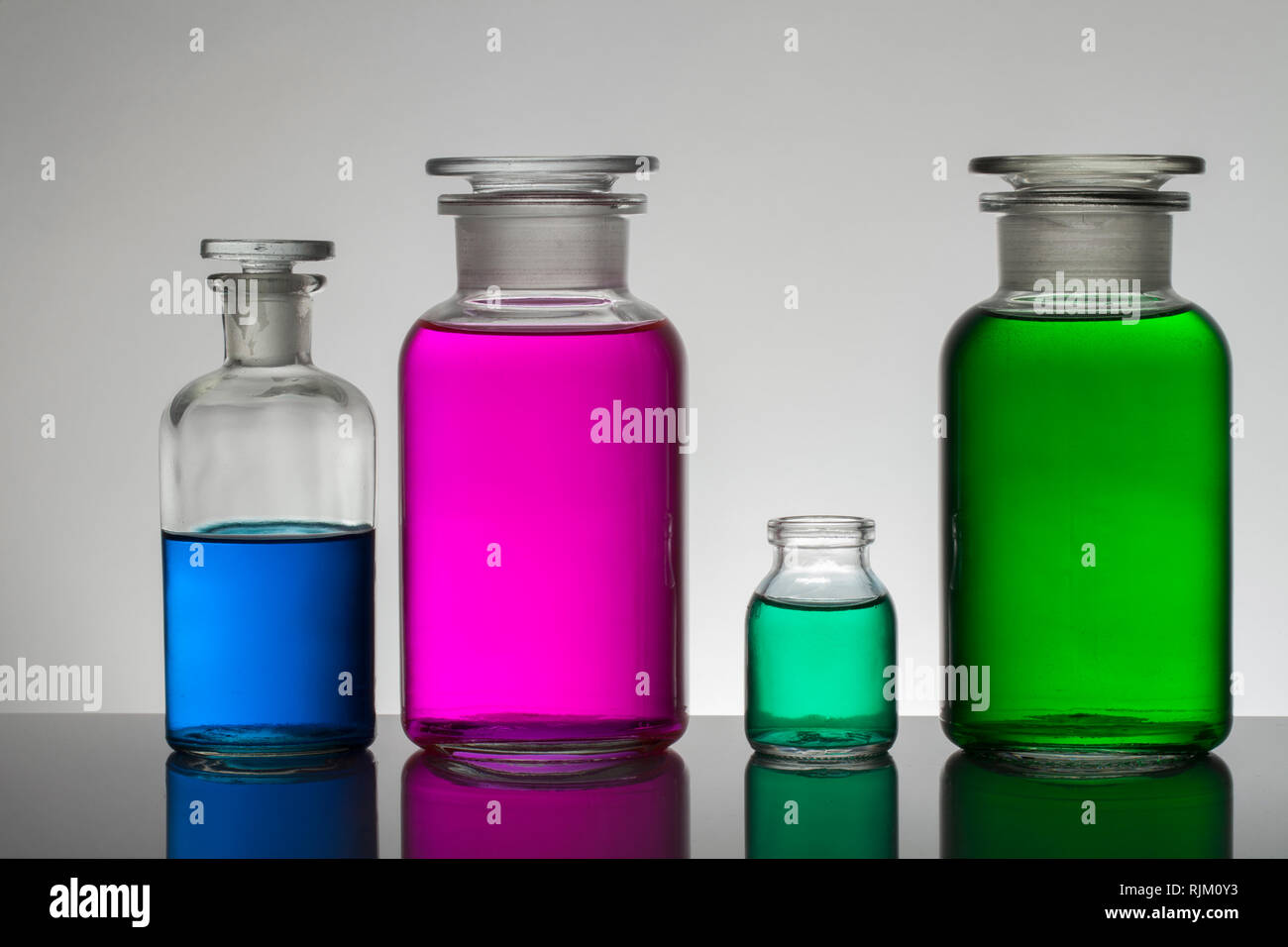 Liquid in laboratory bottles. Scientific biochemical laboratory ...