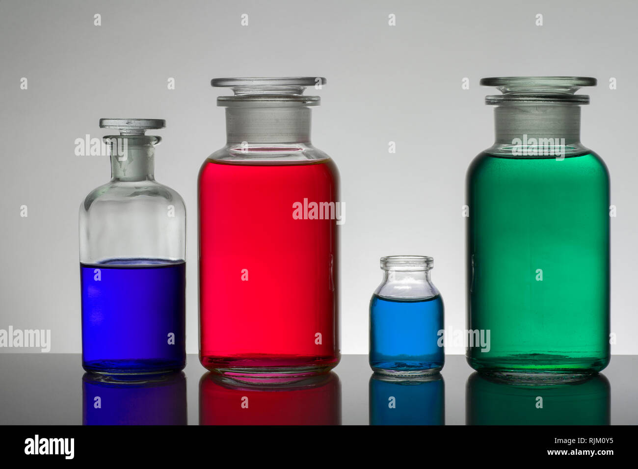 Liquid in laboratory bottles. Scientific biochemical laboratory ...