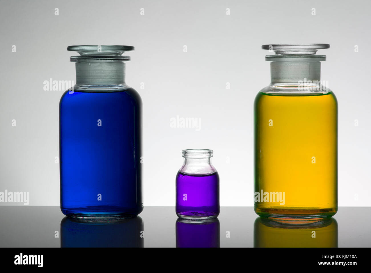 Liquid in laboratory bottles. Scientific biochemical laboratory ...