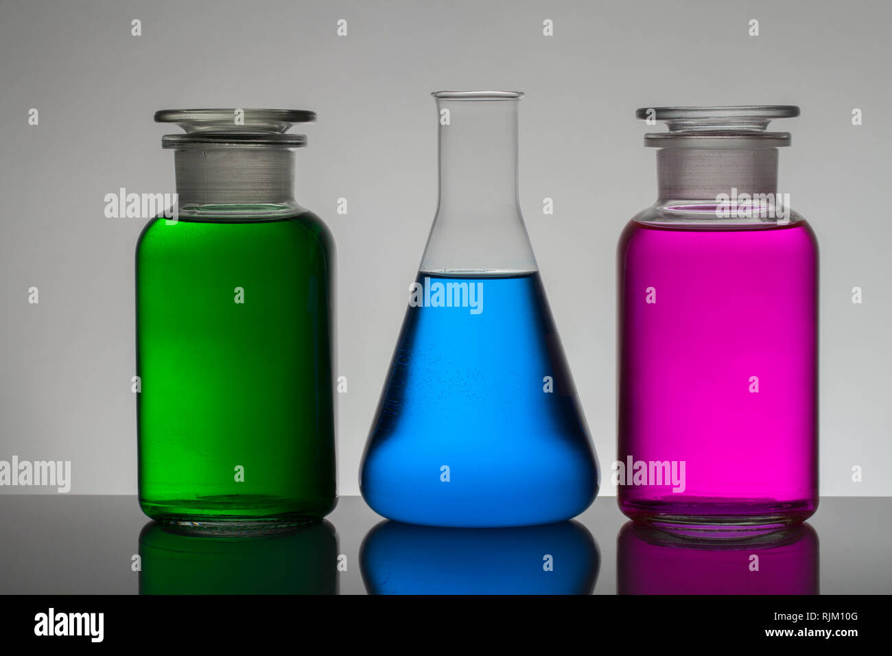 Liquid in laboratory bottles. Scientific biochemical laboratory ...