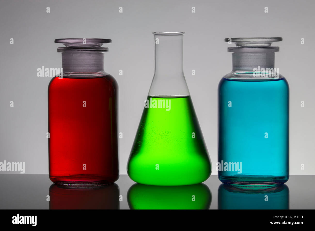 Liquid in laboratory bottles. Scientific biochemical laboratory ...