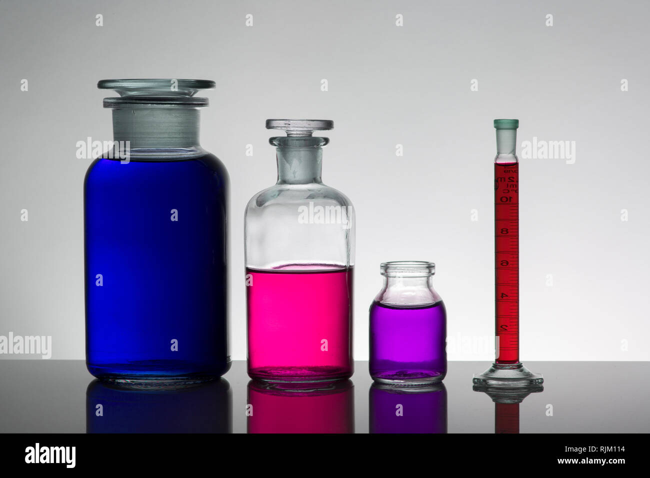 Liquid in laboratory bottles. Scientific biochemical laboratory ...