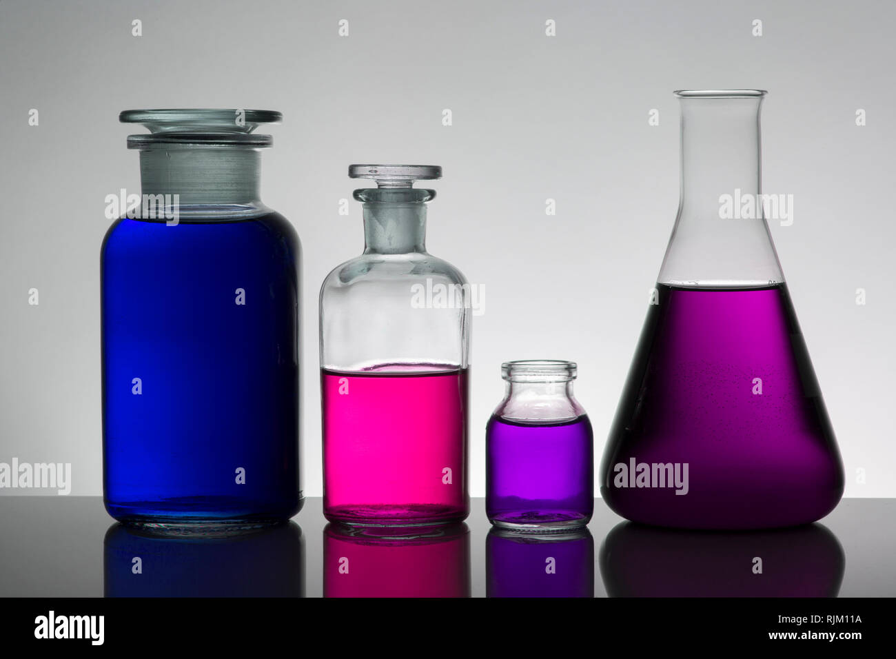 Liquid in laboratory bottles. Scientific biochemical laboratory ...