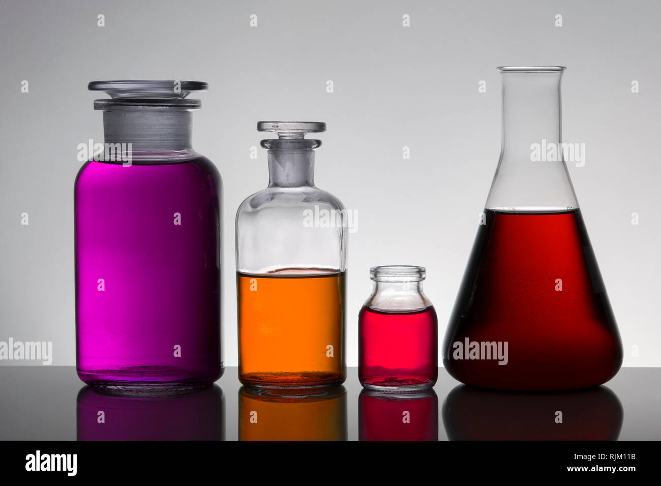 Liquid in laboratory bottles. Scientific biochemical laboratory ...