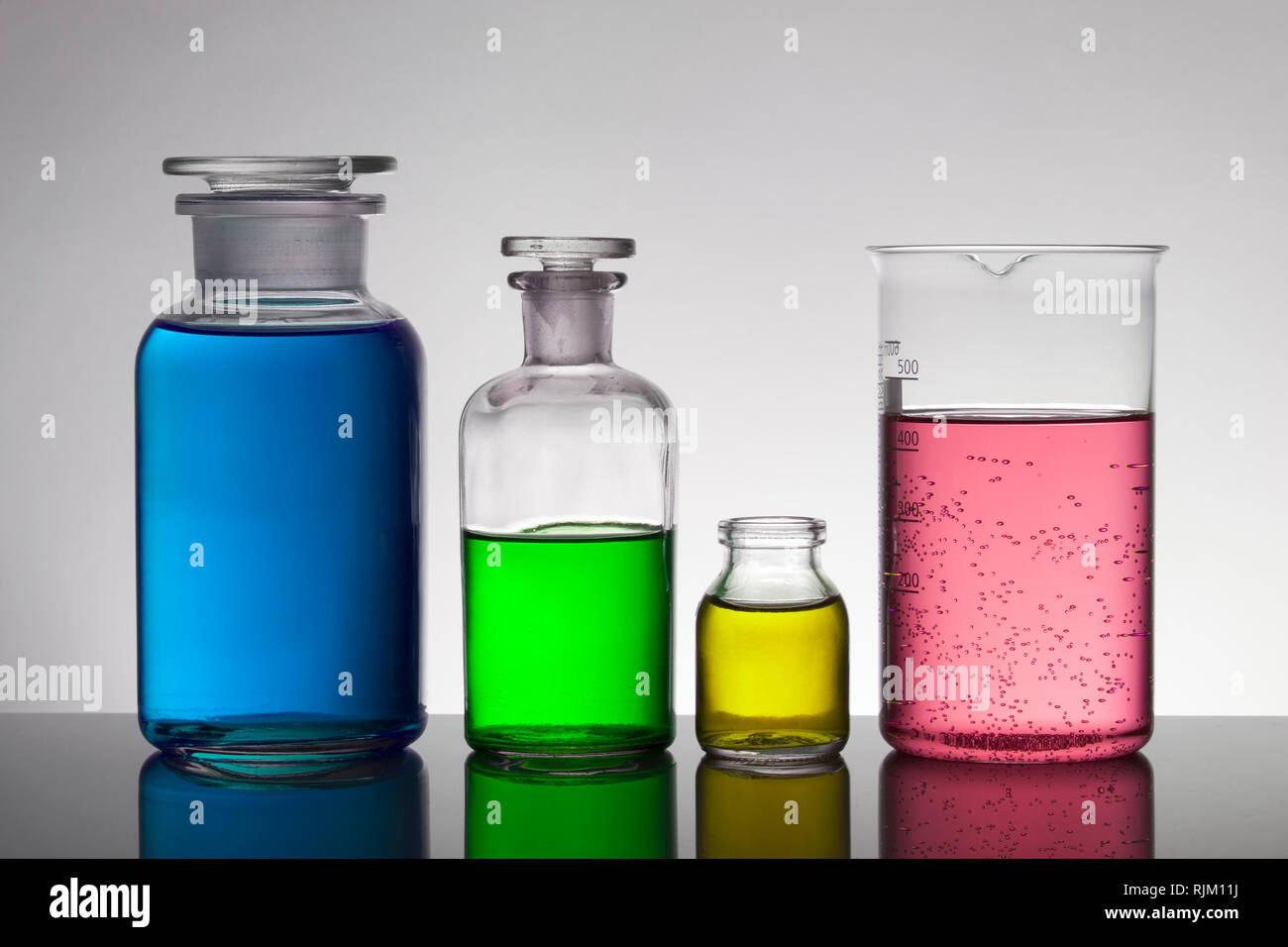 Liquid in laboratory bottles. Scientific biochemical laboratory ...