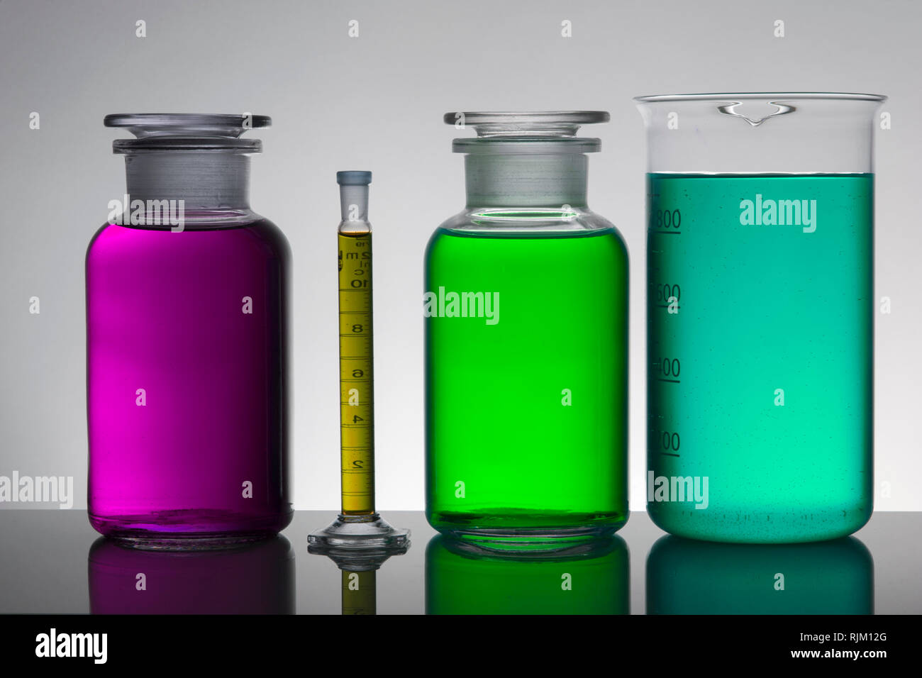 Liquid in laboratory bottles. Scientific biochemical laboratory ...