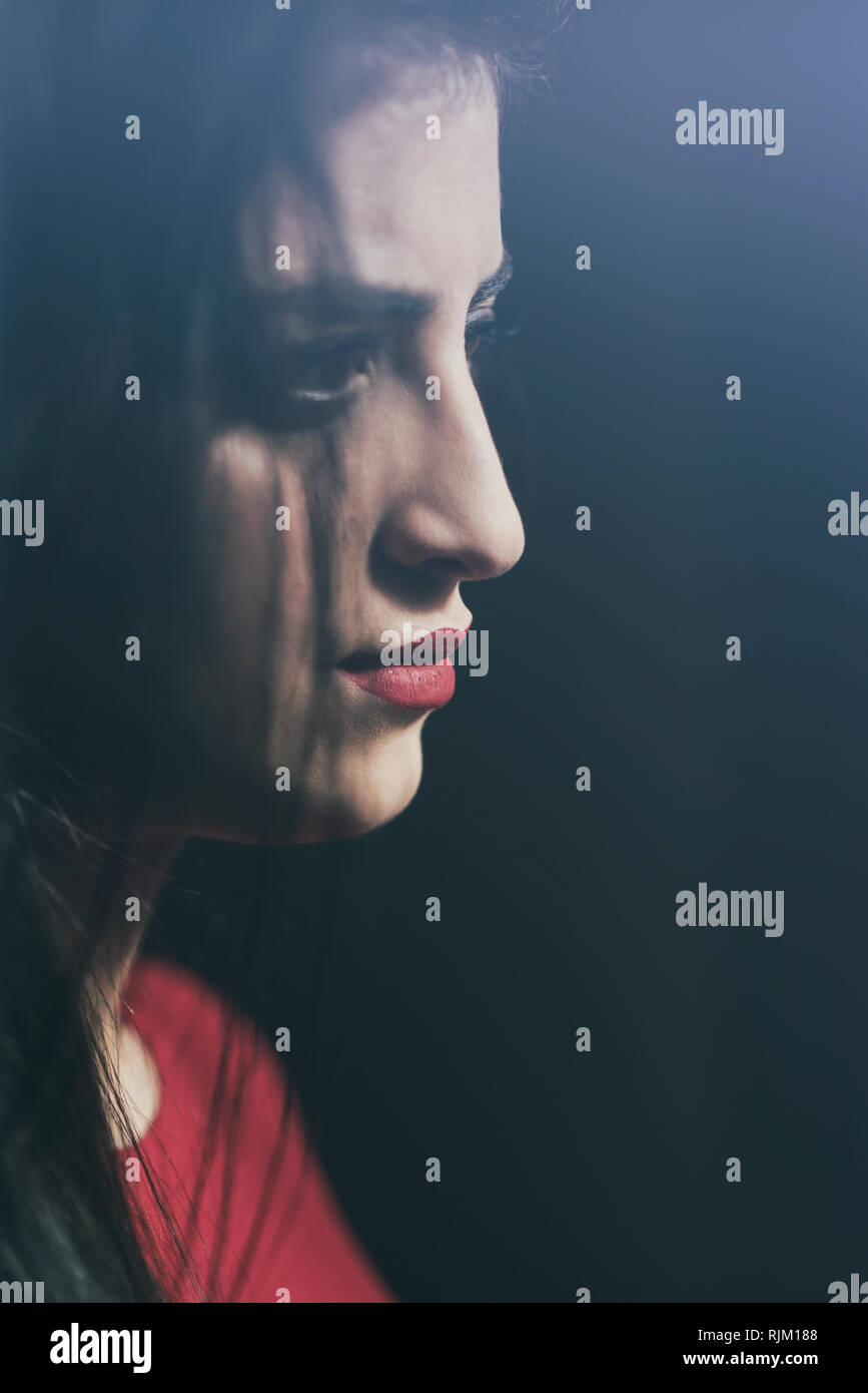 Side view portrait of a serious young woman looking away Stock Photo ...