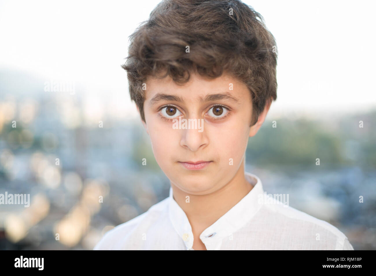 Child boy looking at camera staring hi-res stock photography and images ...