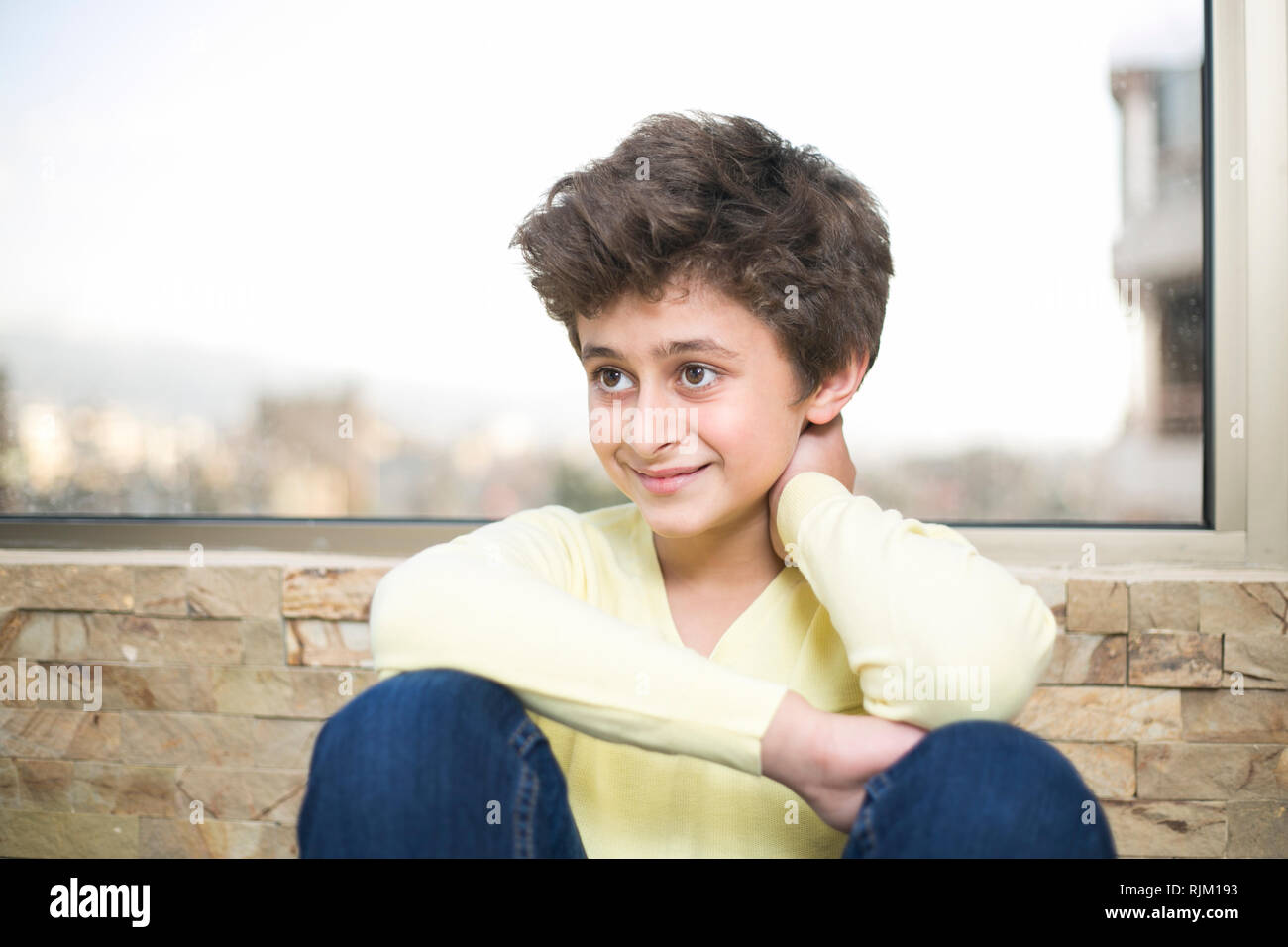 Happy boy looking away smiling Stock Photo - Alamy