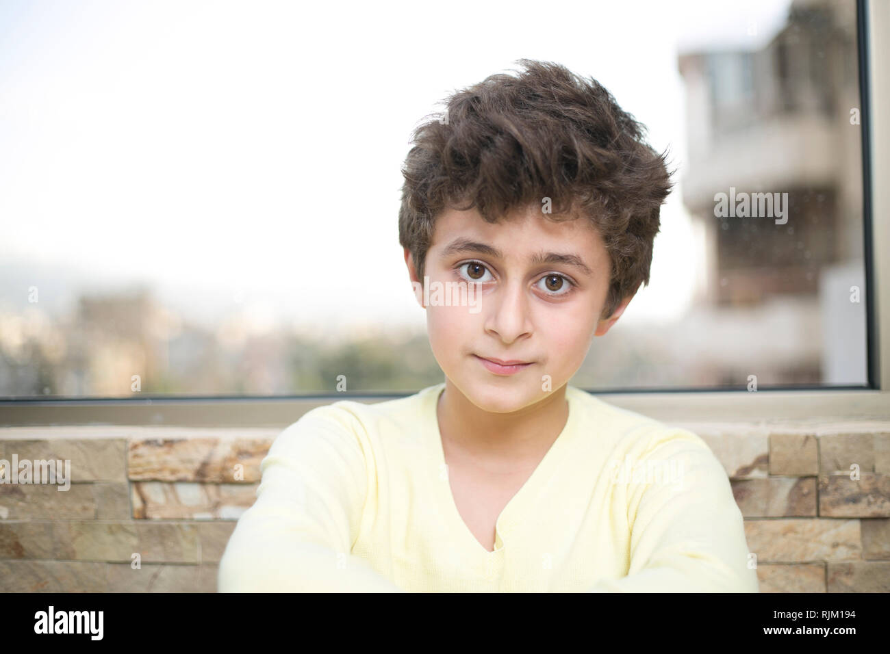 Handsome boy looking at camera Stock Photo - Alamy