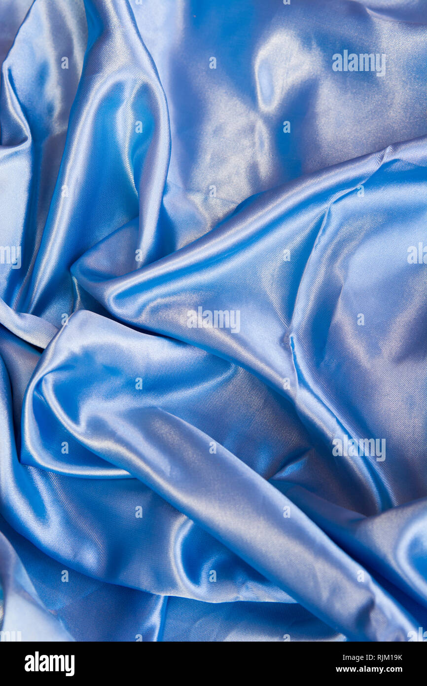 Close up of baby blue satin fabric Stock Photo - Alamy
