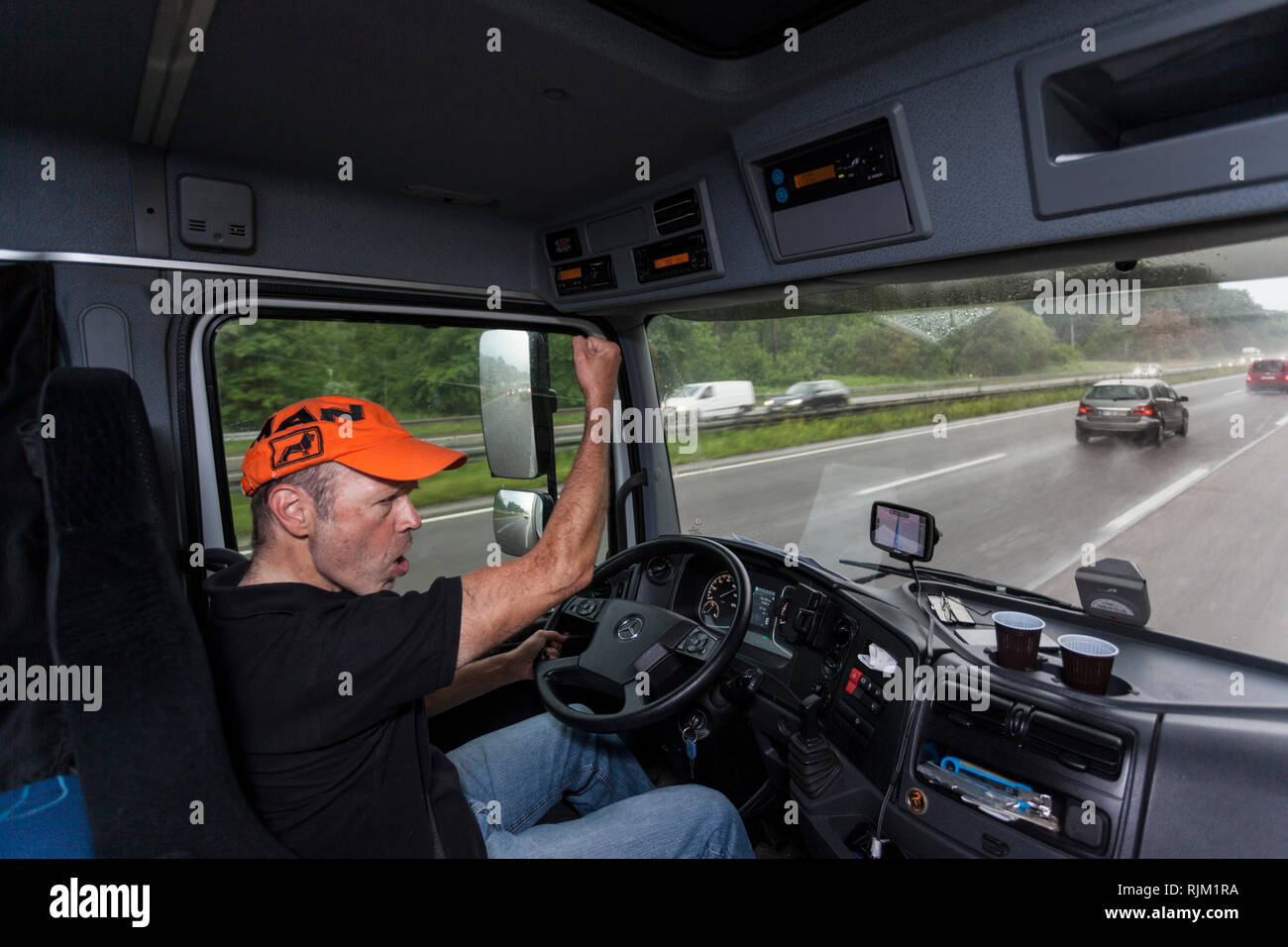 Professional driver on the highway Stock Photo - Alamy