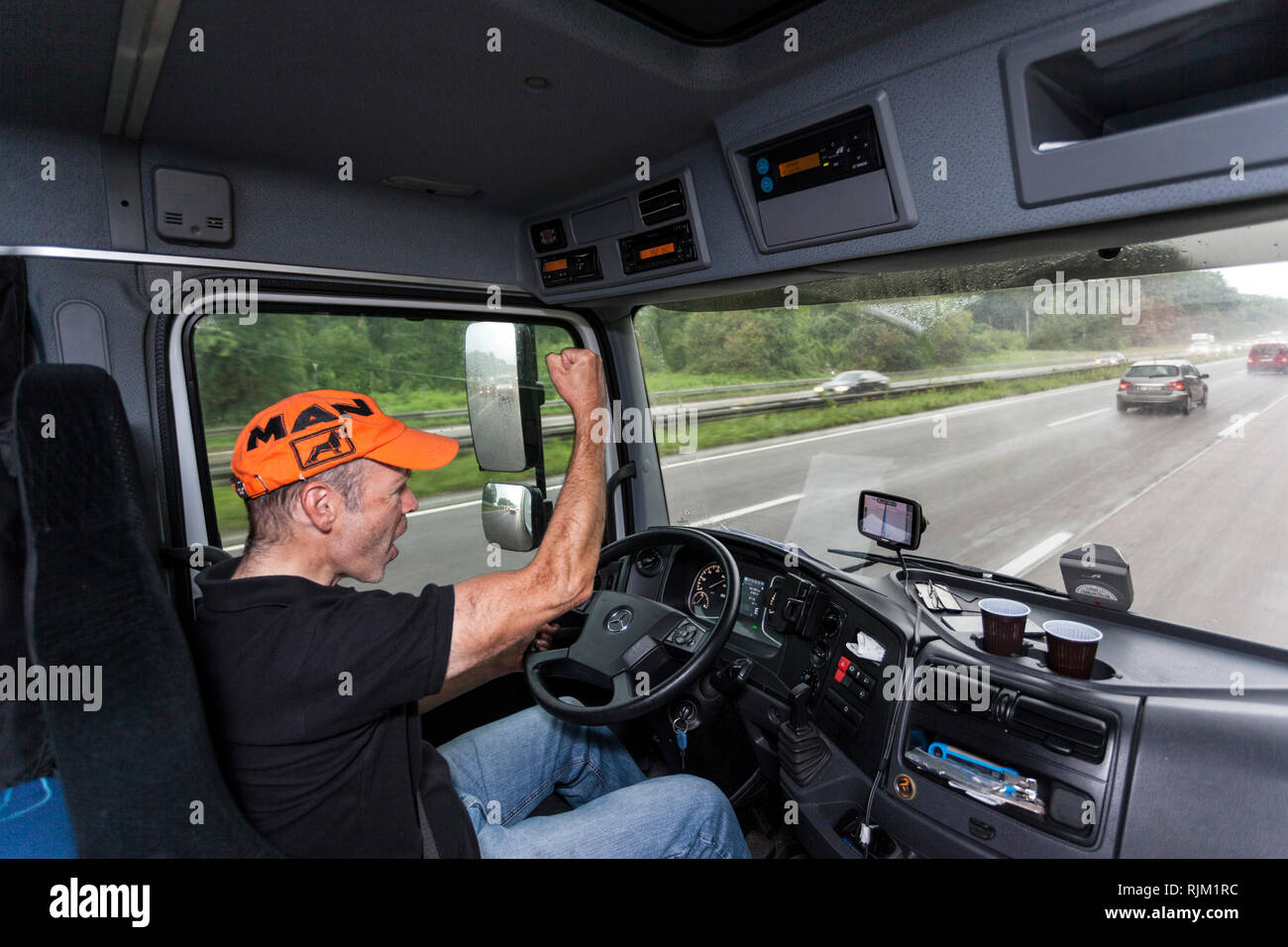 Professional driver on the highway Stock Photo - Alamy