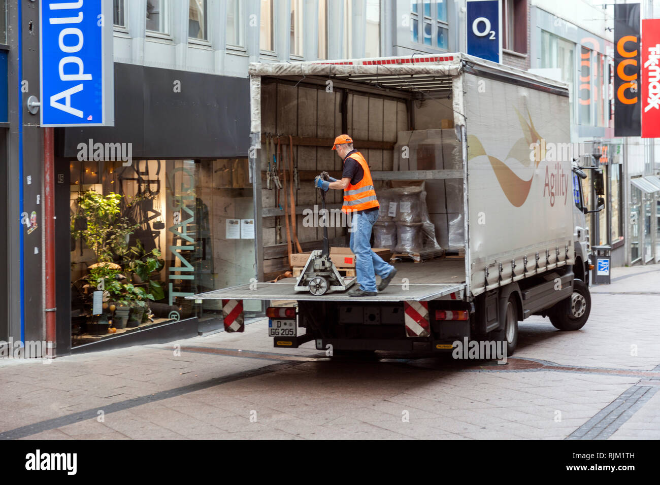 Spedition delivers bulky goods in the pedestrian zone Stock Photo - Alamy