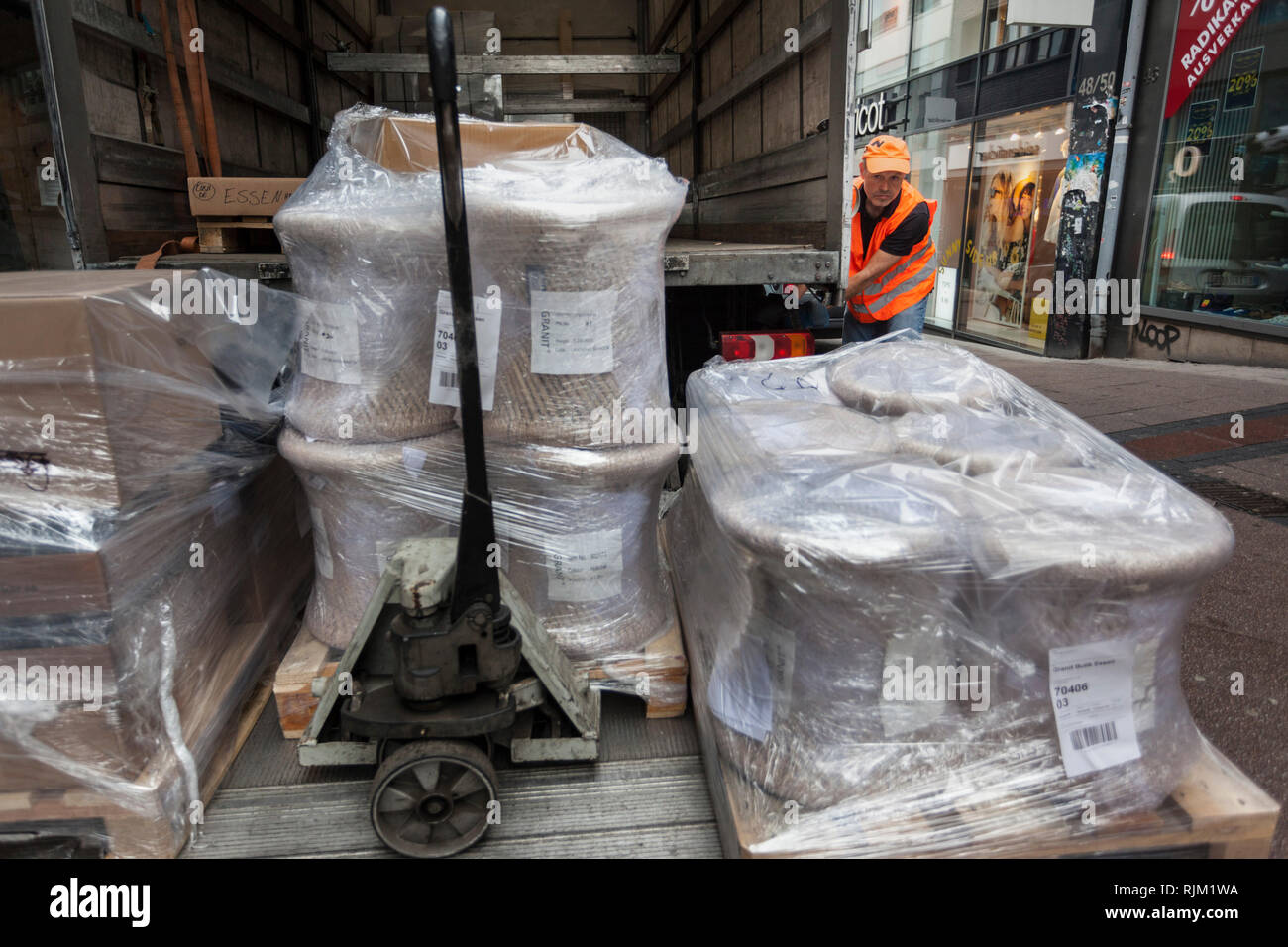 Spedition delivers bulky goods in the pedestrian zone Stock Photo - Alamy