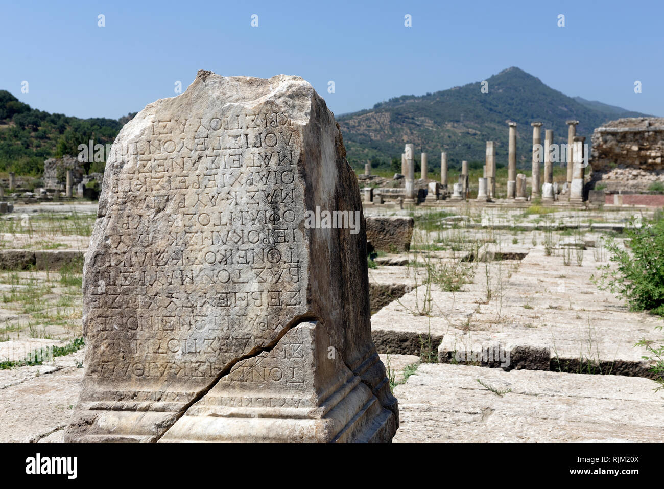 Statue pedestal with ancient Greek text, Agora propylon is in the ...
