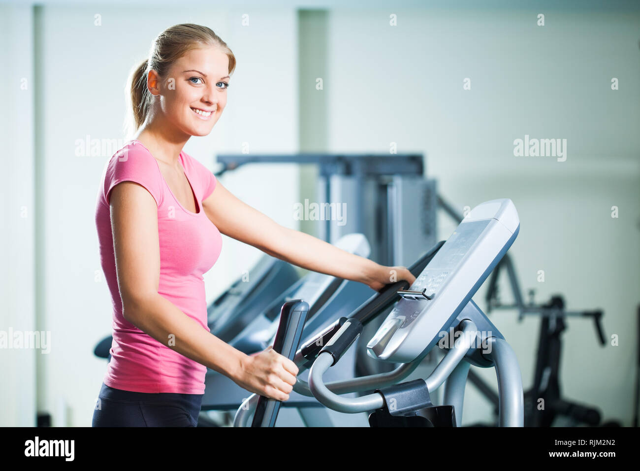 Woman treadmill happy walking hi-res stock photography and images - Alamy