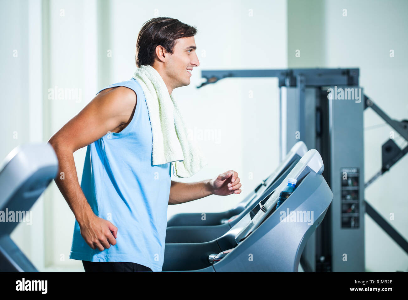 Happy man exercising in gym Stock Photo - Alamy