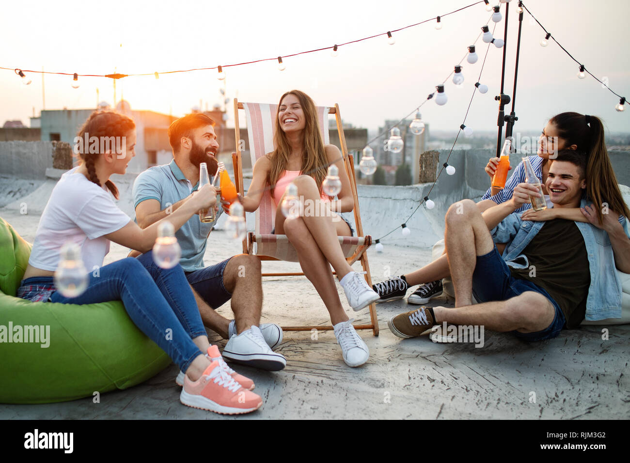 Group of young happy friends having party and fun Stock Photo - Alamy