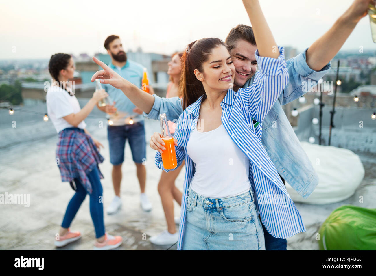 Happy lovely couple having fun time at party Stock Photo - Alamy