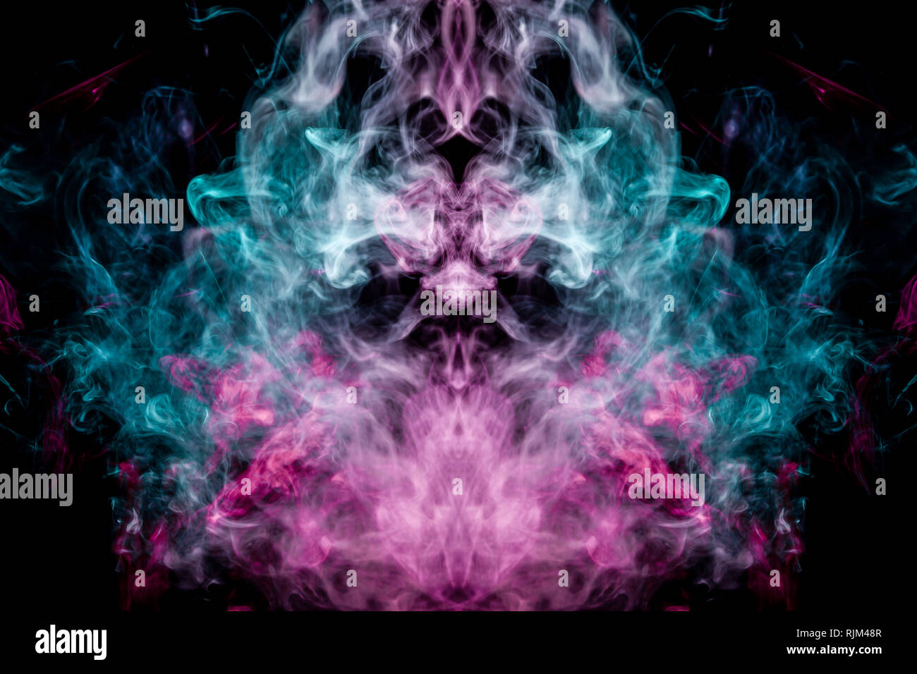 Dense multicolored smoke of blue and purple colors in the form of a ...