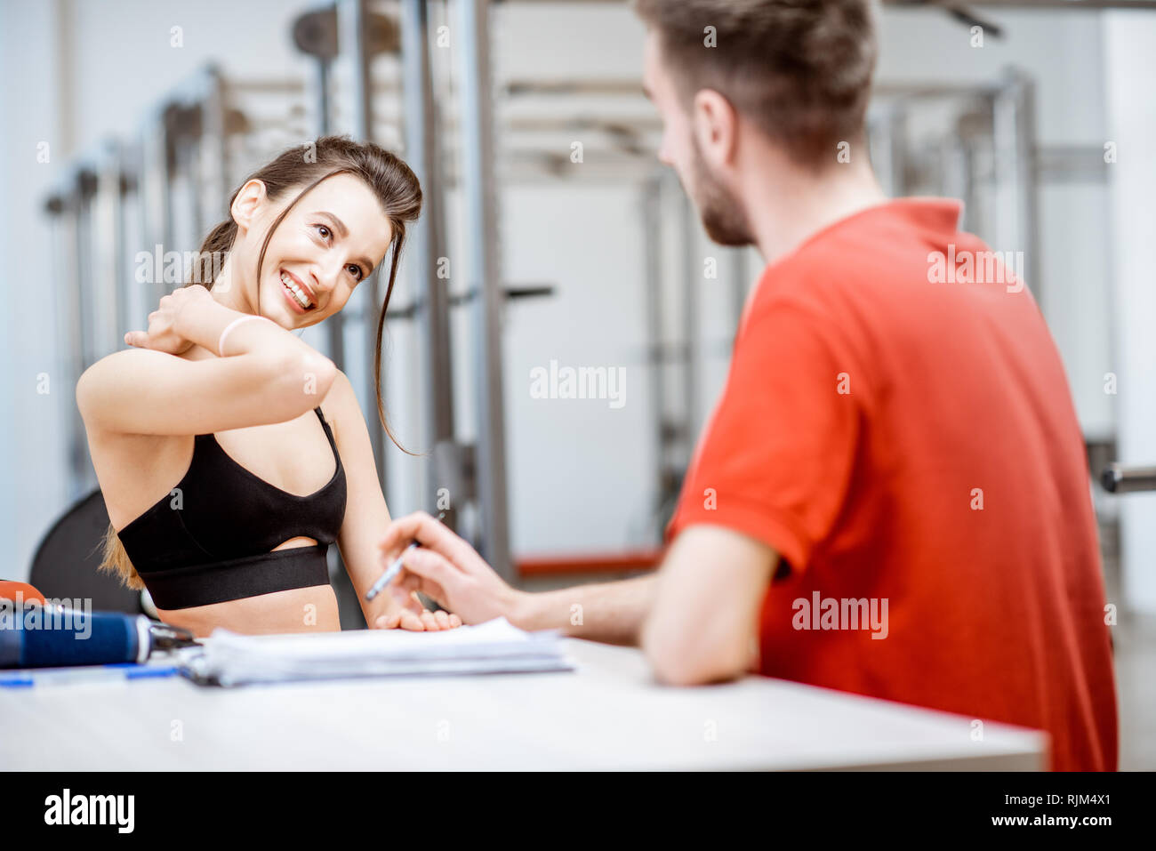 Young woman during the medical consultation with rehab at the ...