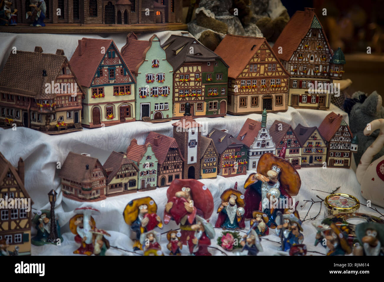 Many miniature houses and figures in a window Stock Photo - Alamy
