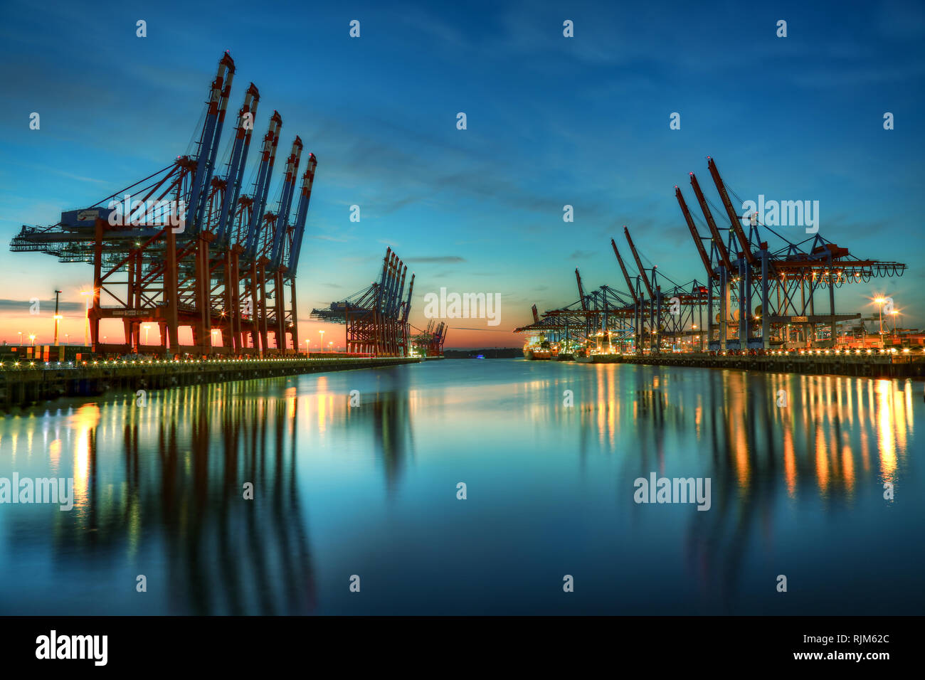 Container terminal Burchardkai in the port of Hamburg during blue hour ...
