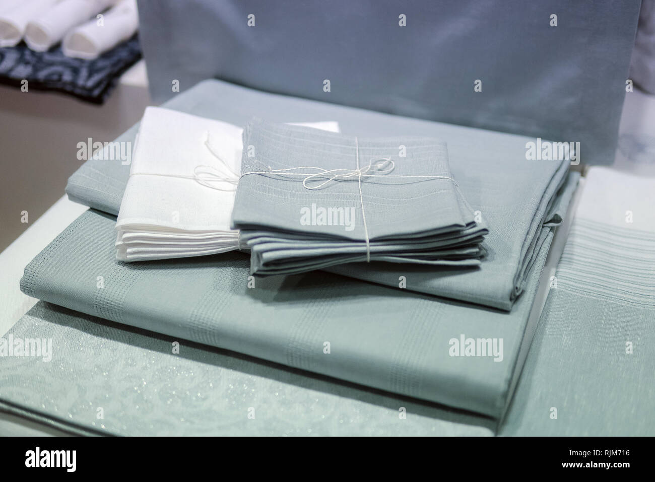 Tablecloths over table. Wooden table covered with tablecloth. Top view ...
