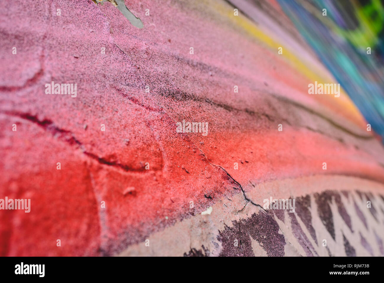 Detail of an anonymous street graffiti with many colors, cheerful urban ...