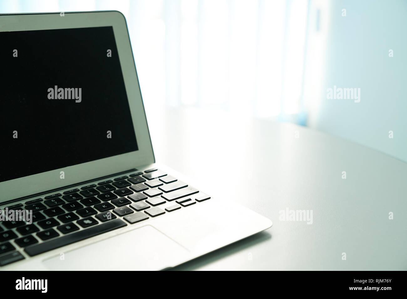 Workplace with laptop windows view hi-res stock photography and images ...