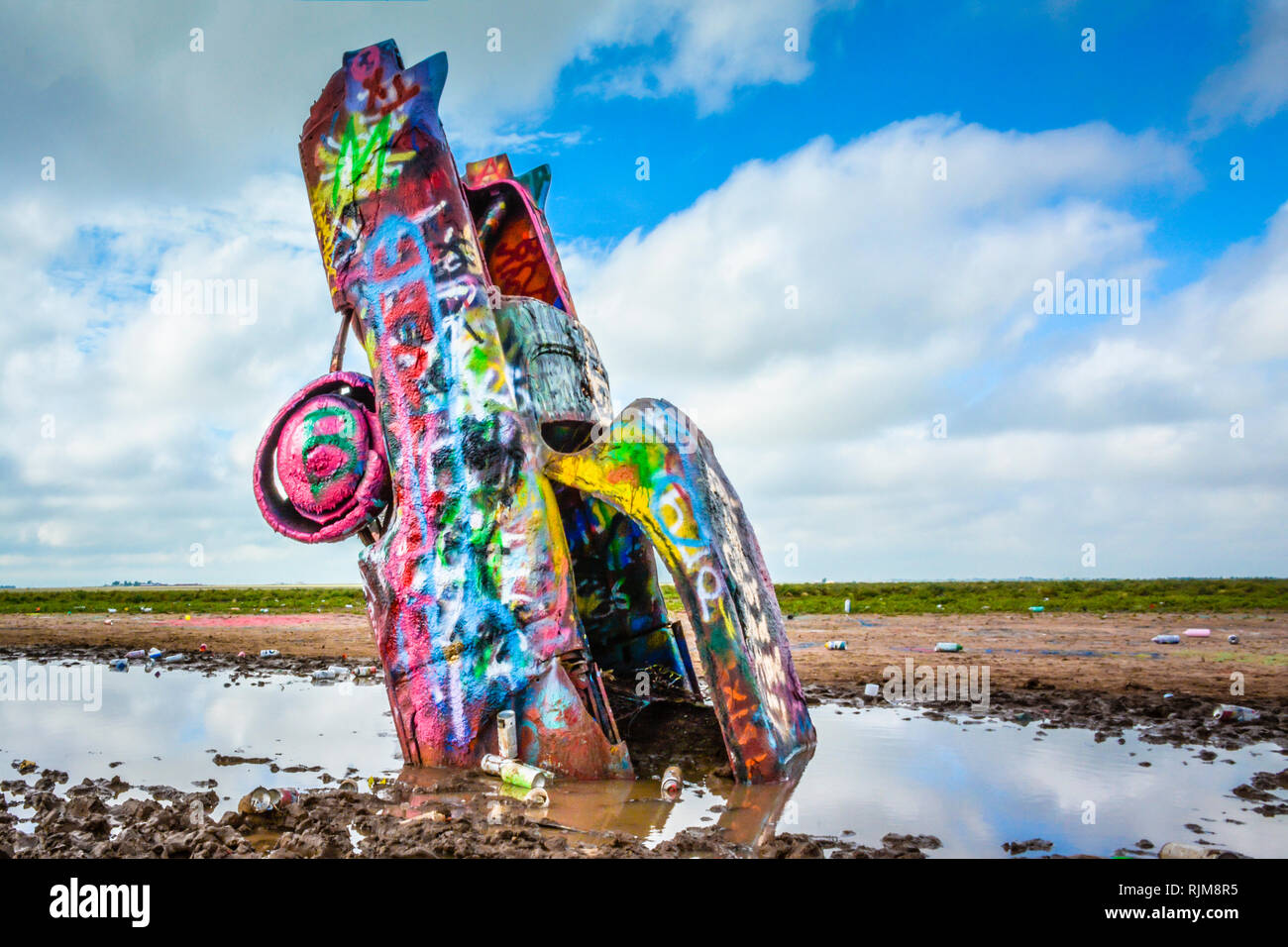 Cadillac Ranch is an art installation comprised of old Cadillacs half ...