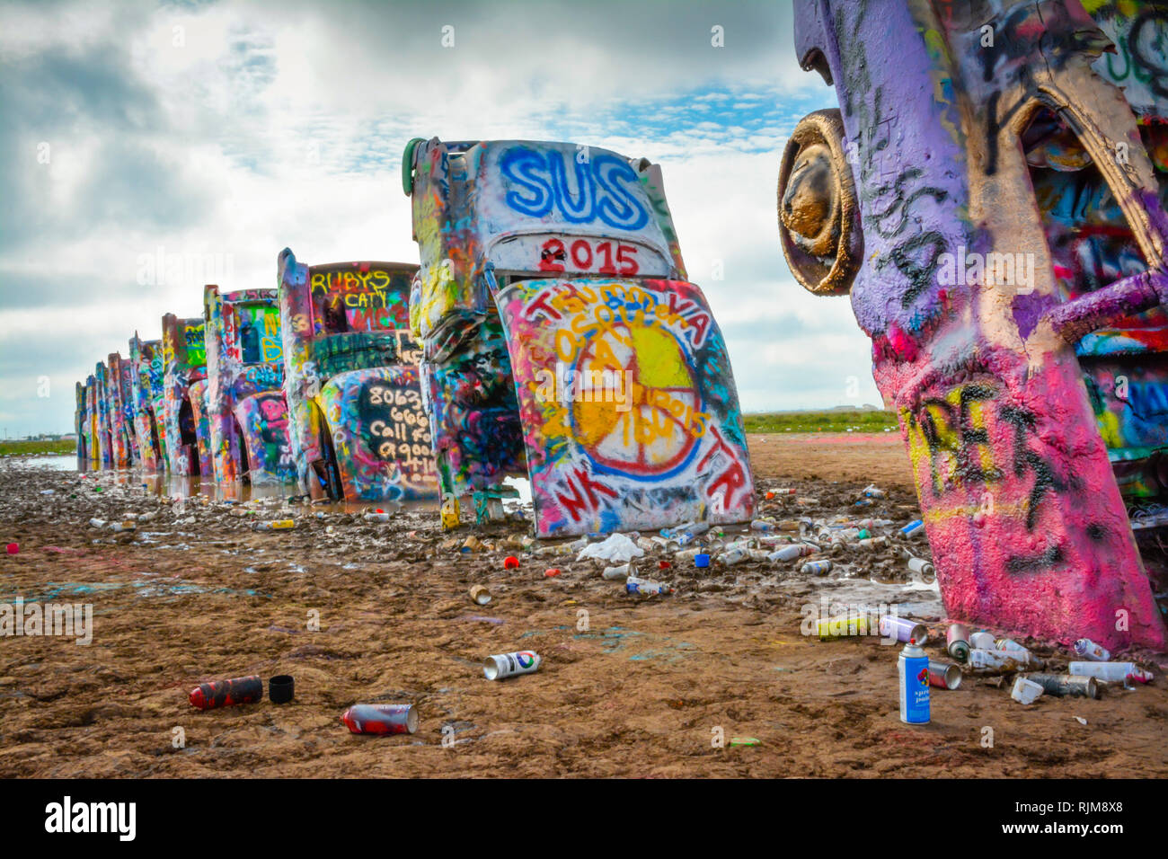 Cadillac Ranch is an art installation comprised of old Cadillacs half ...
