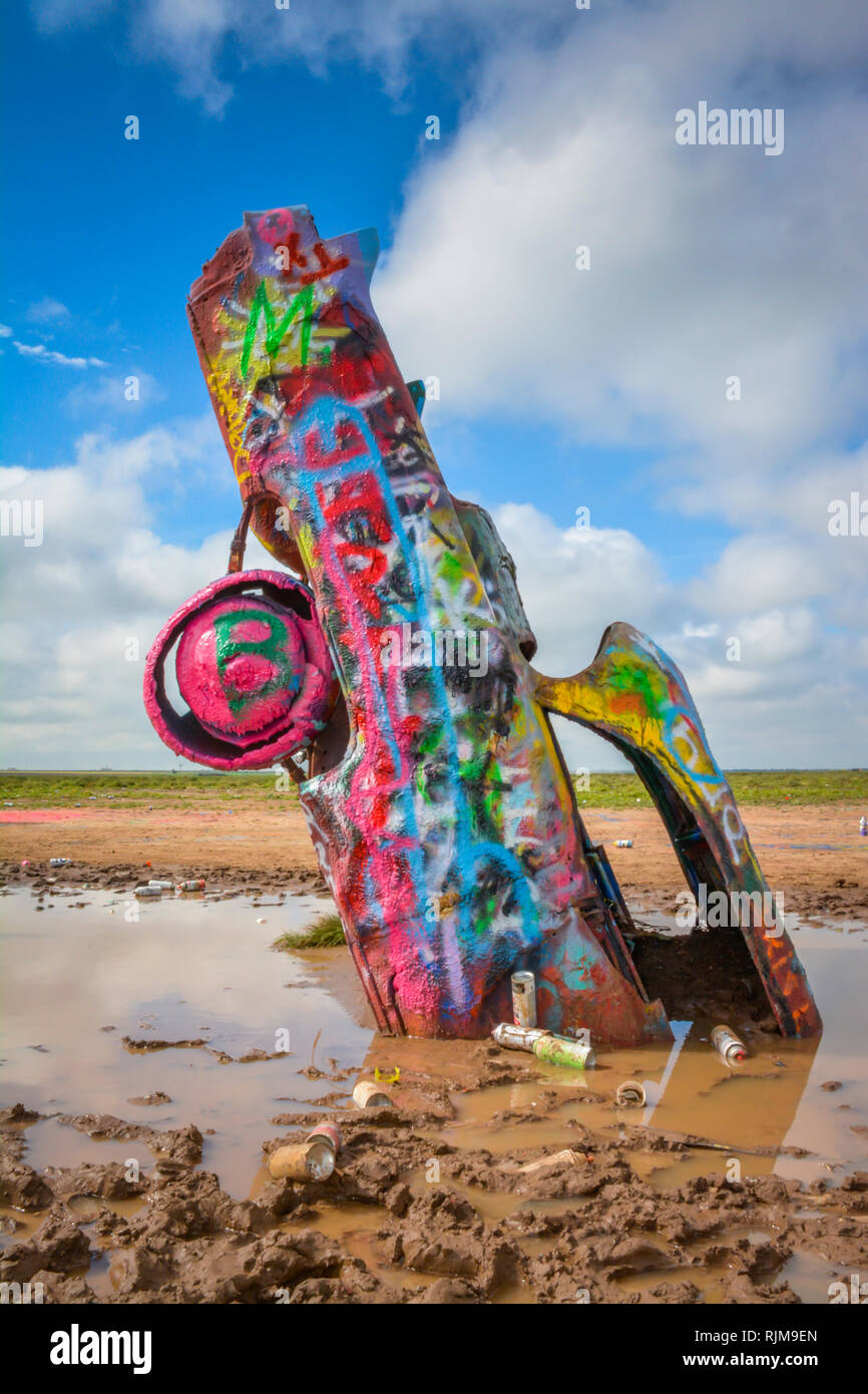 Cadillac Ranch is an art installation comprised of old Cadillacs half ...