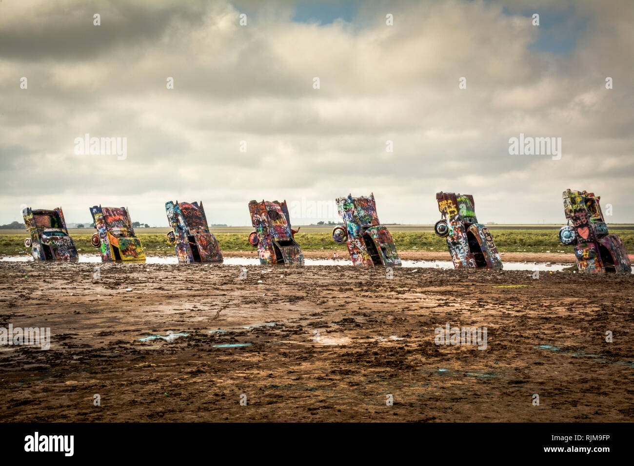 Cadillac Ranch is an art installation comprised of old Cadillacs half ...