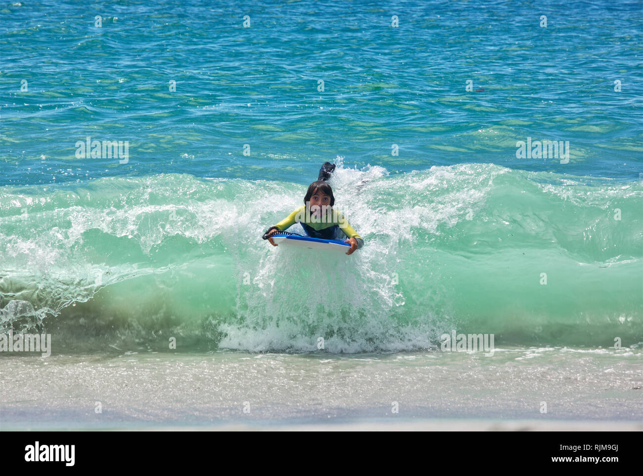 Boy boogie boarding at ocean hi-res stock photography and images - Alamy