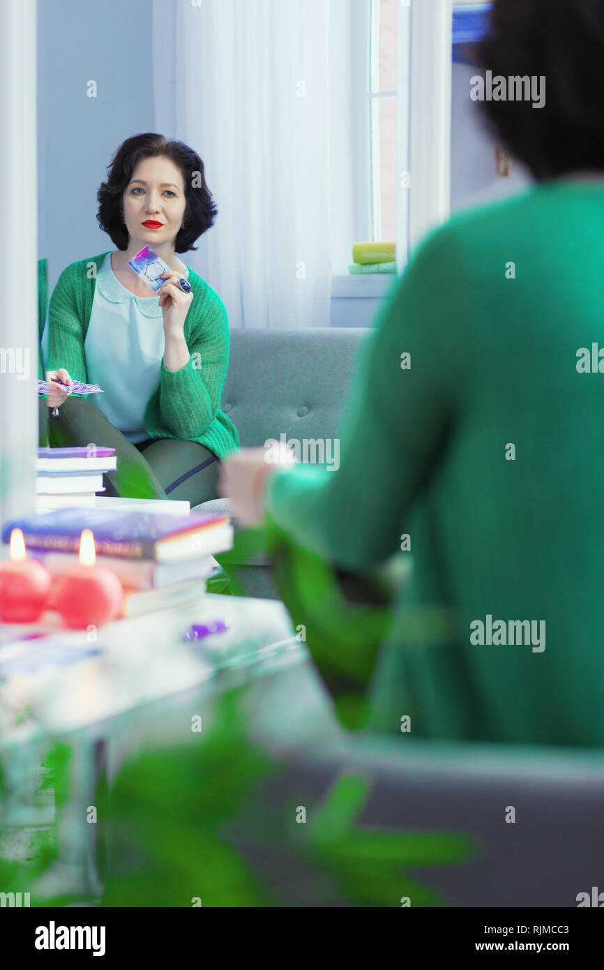 Joyful nice woman seeing her reflection in the mirror Stock Photo - Alamy