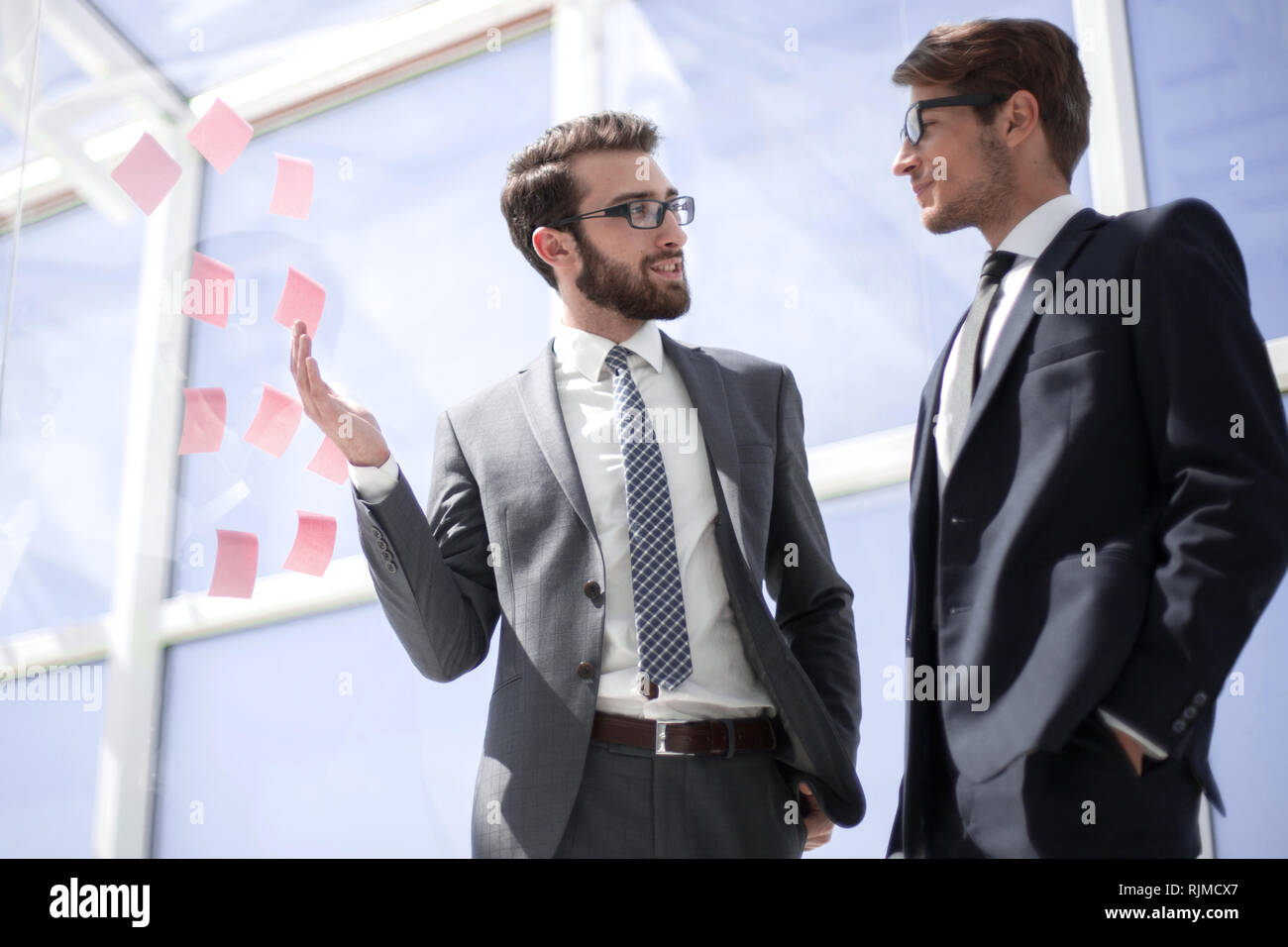 Two colleagues share ideas hi-res stock photography and images - Alamy