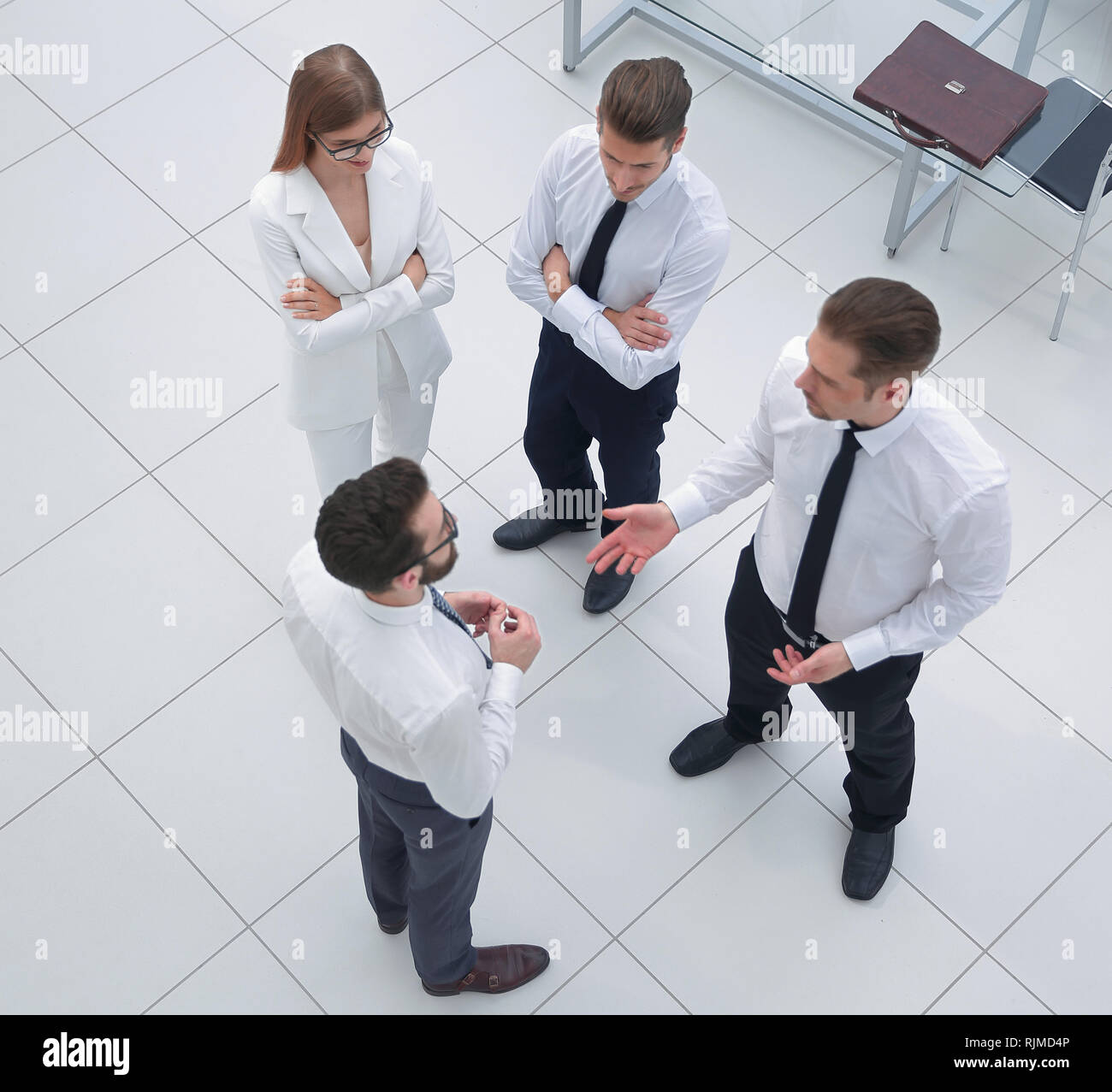 top view.a group of business people talking standing in the office ...