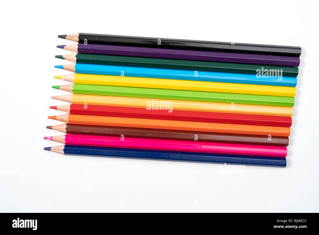 Colored pencils in a row isolated on white background Stock Photo - Alamy