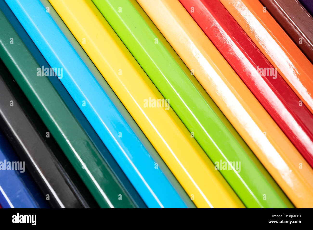 Colored pencils in a row isolated on white background Stock Photo - Alamy