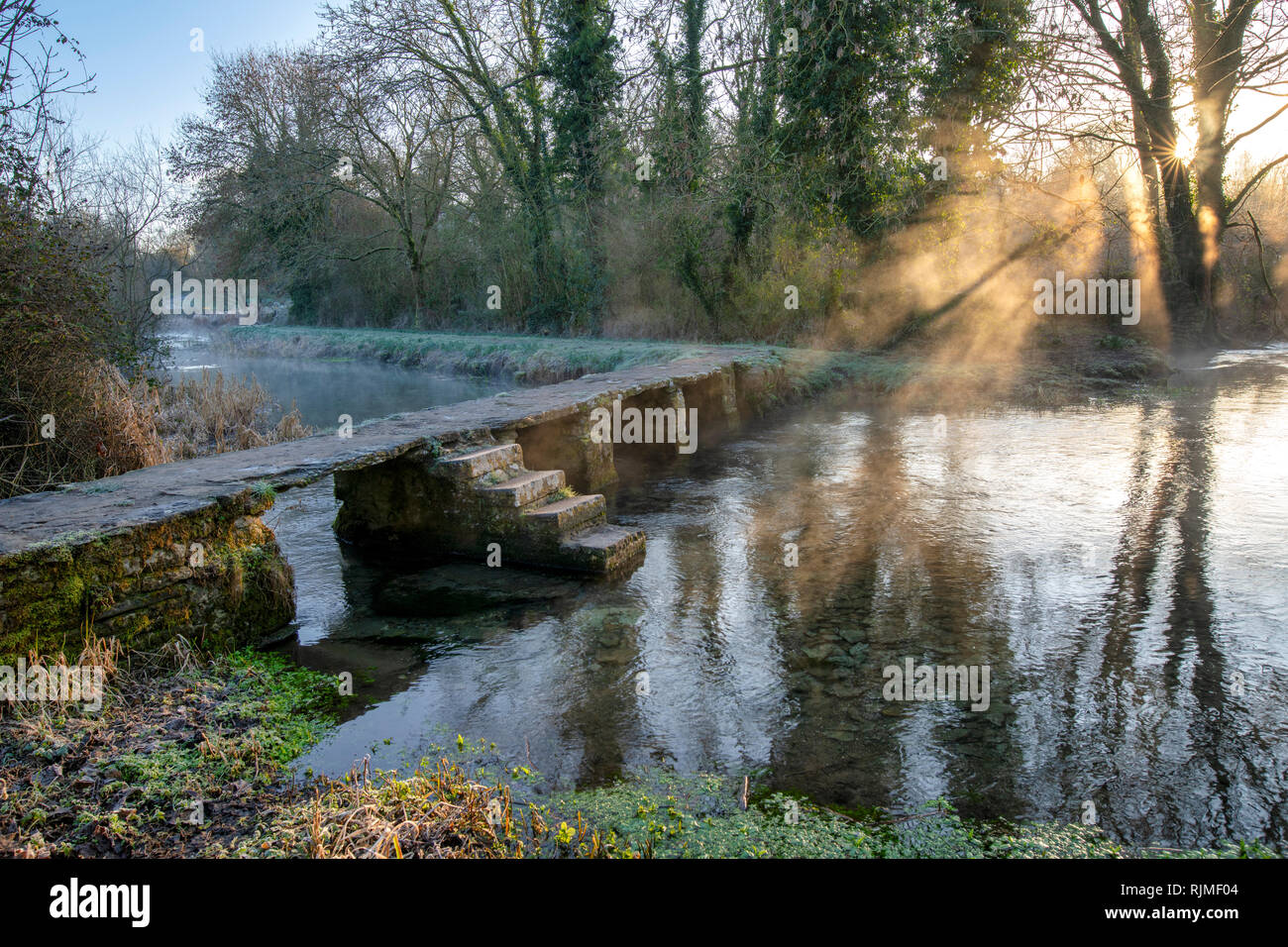 Stone clapper bridge crossing the River Leach at Eastleach Turville in ...