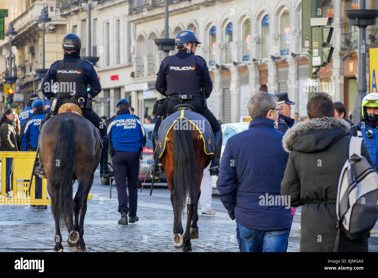 Mounted Police officers, Puerta del Sol, Madrid, Spain Stock Photo - Alamy