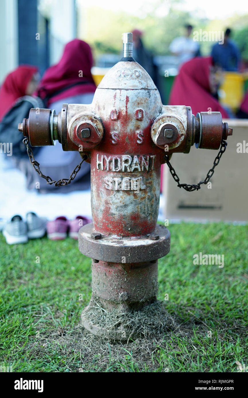 Old Red fire hydran outside building Stock Photo - Alamy