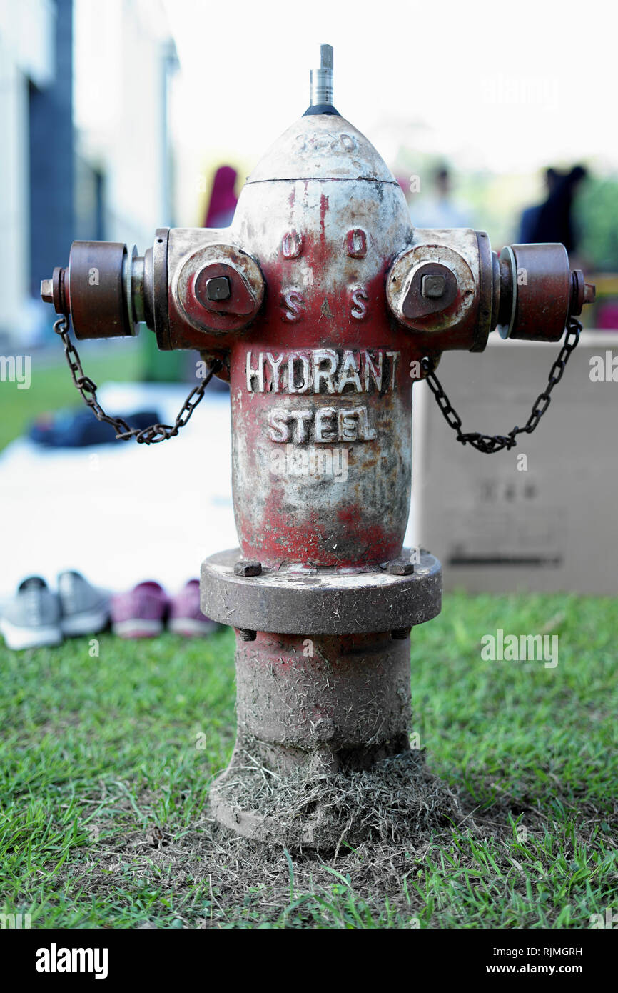 Old Red fire hydran outside building Stock Photo - Alamy