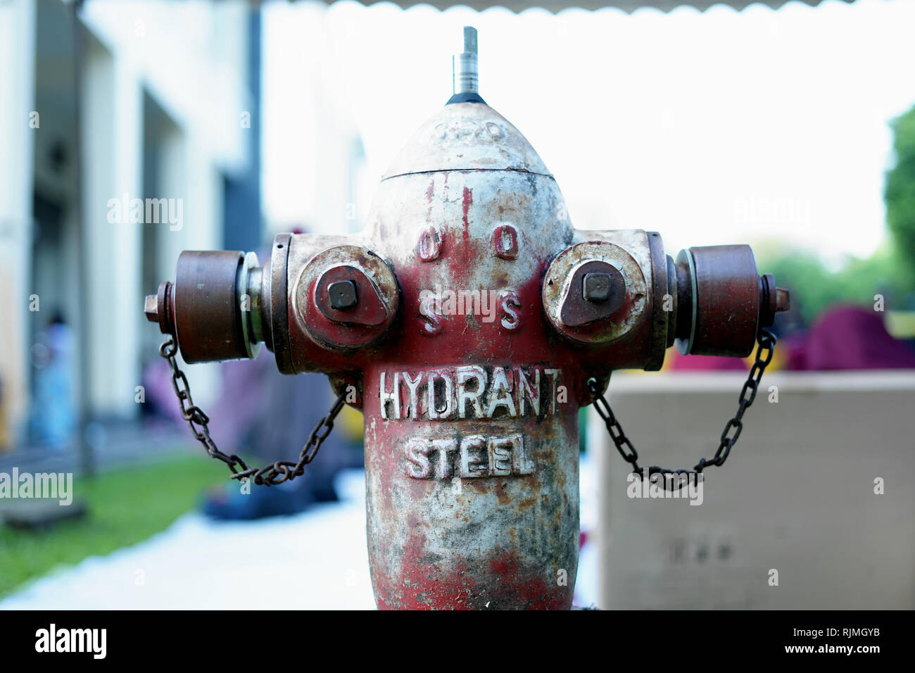 Old Red fire hydran outside building Stock Photo - Alamy