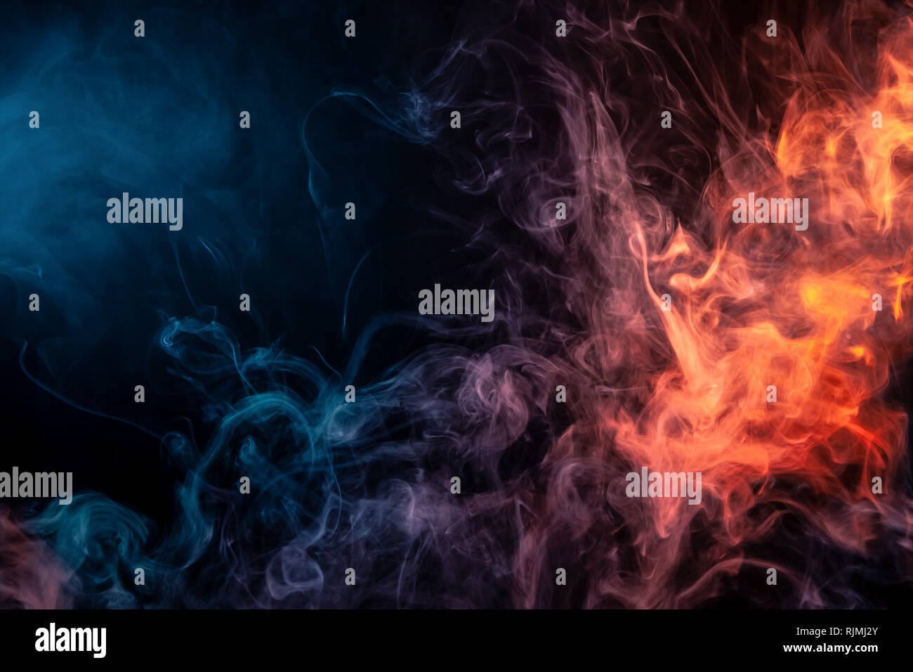 Blue and red bomb smoke on black isolated background Stock Photo - Alamy