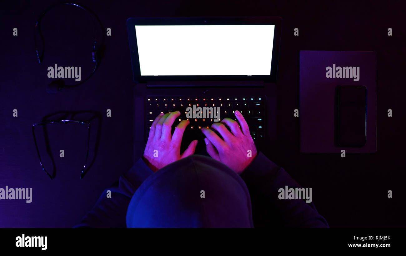 Hacker hacking system on a laptop. White Display Stock Photo - Alamy
