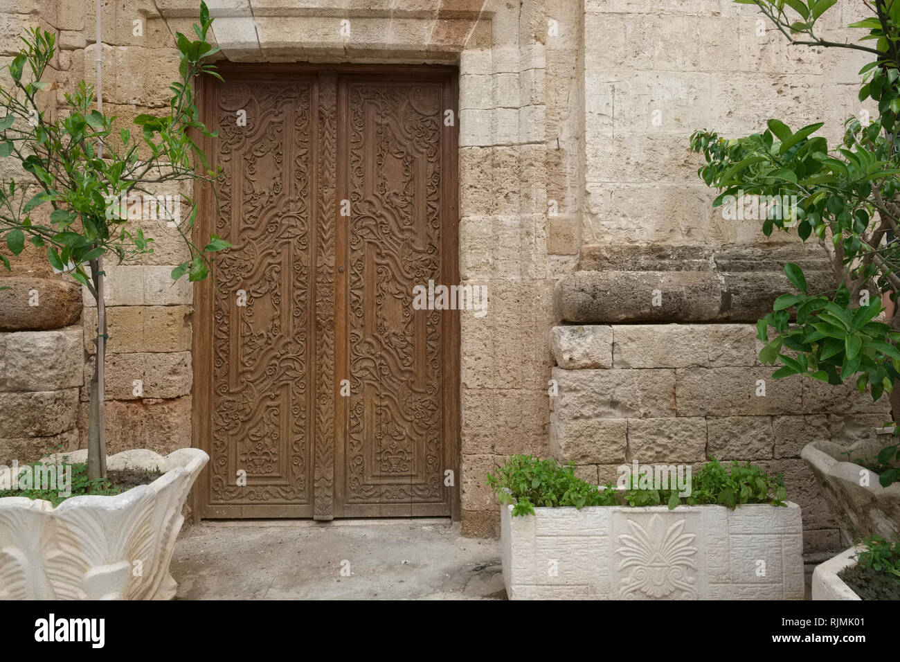 Elaborately carved wooden side door in Chania, Crete Stock Photo - Alamy