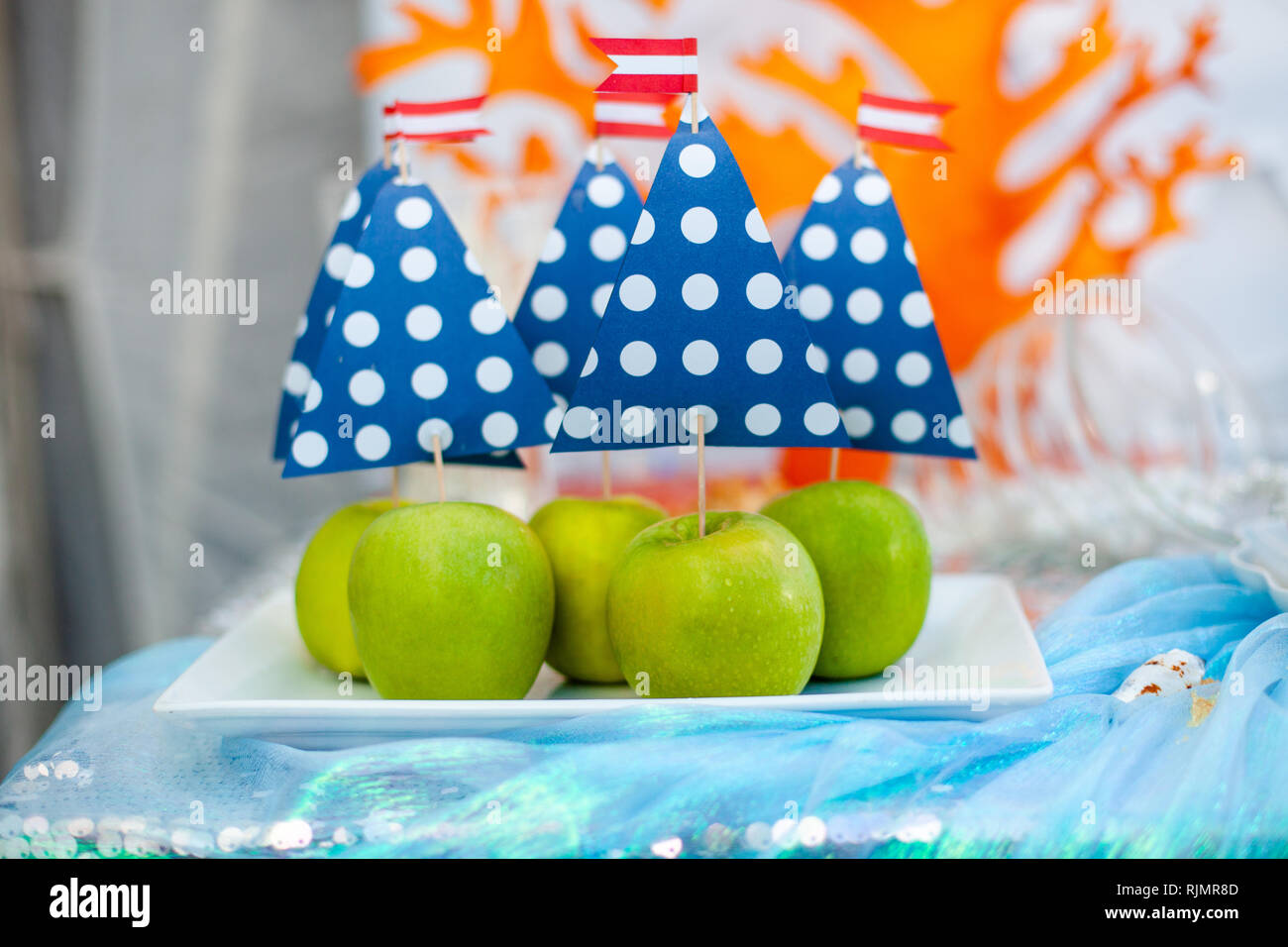 Green apples with blue paper sail. Sea time theme on the party's candy ...
